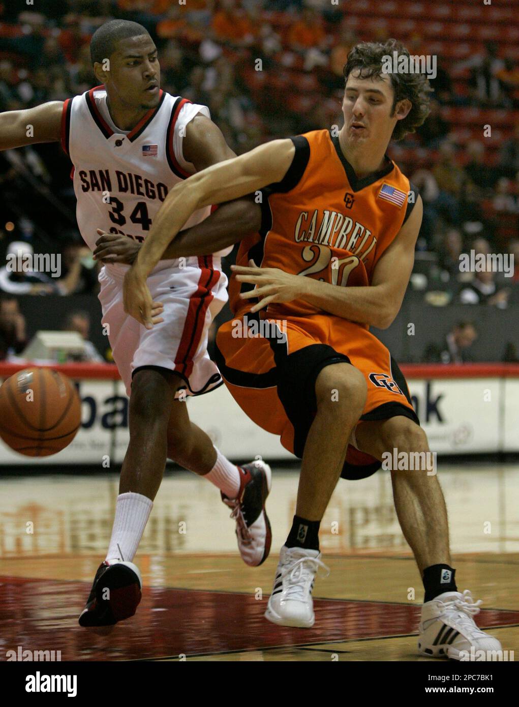 Campbell's Russ Gibson whips a no-look pass around San Diego State's ...