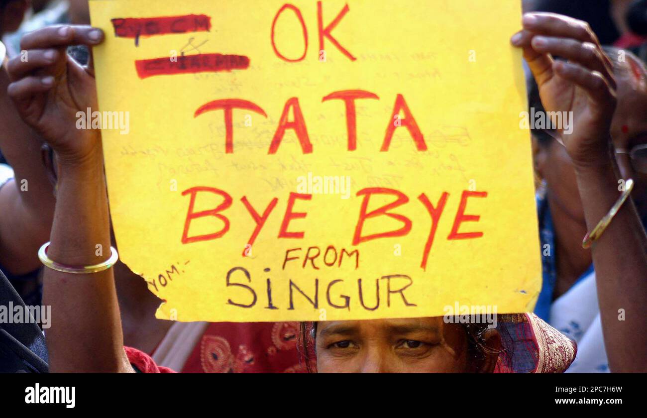 A woman activist of Trinamool Congress party holds a poster during a ...