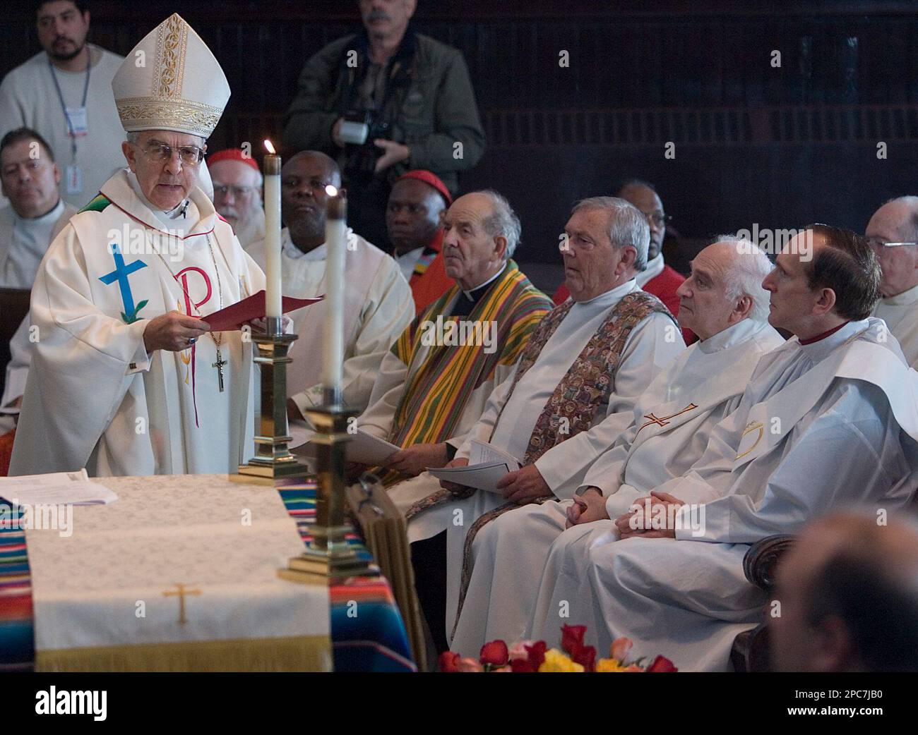 Archbishop Patrick Trujillo, left, helps performs a ceremony to install ...