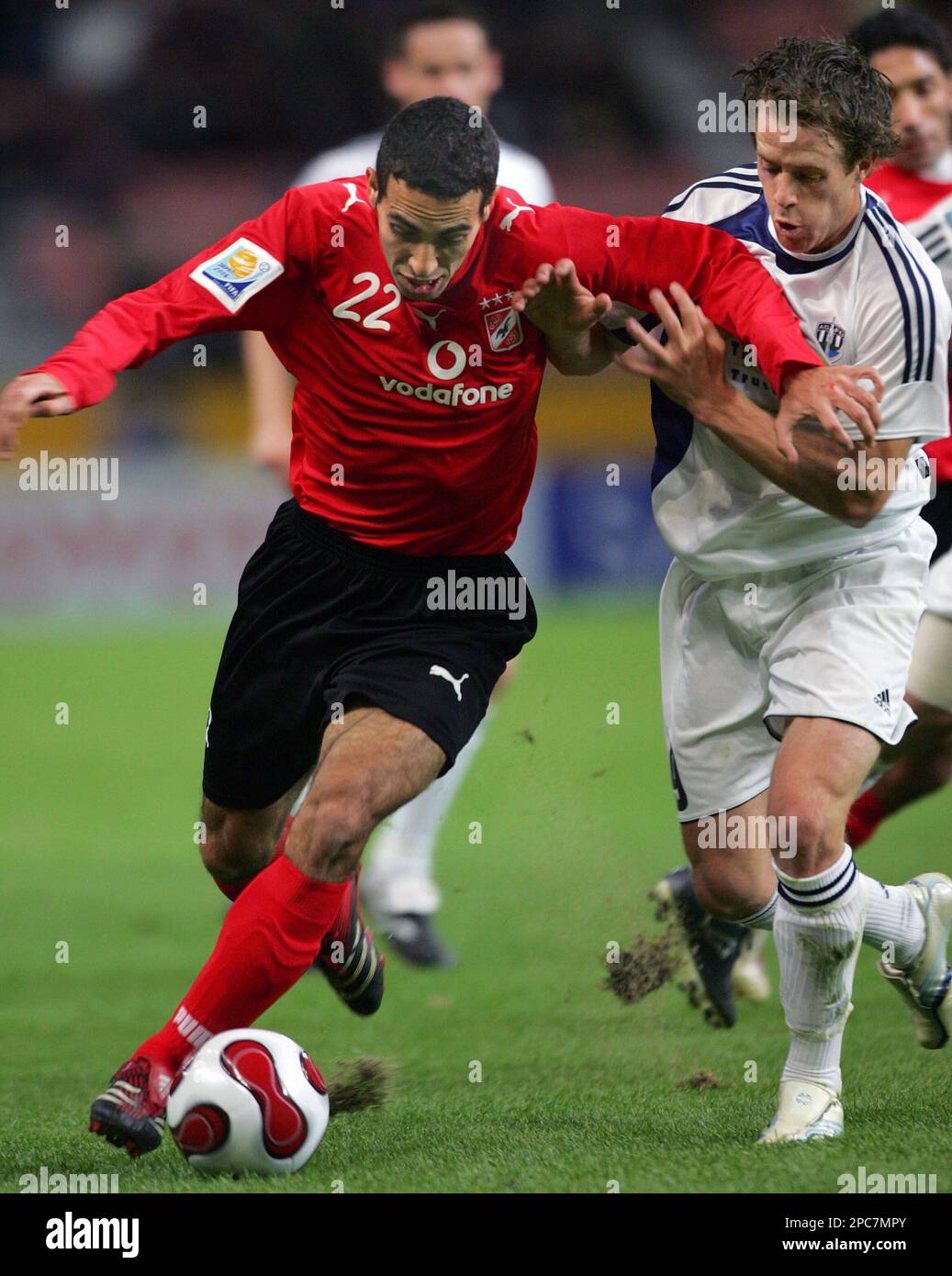 Al Ahly's Mohamed Aboutrika, left, of Egypt battles for the ball ...