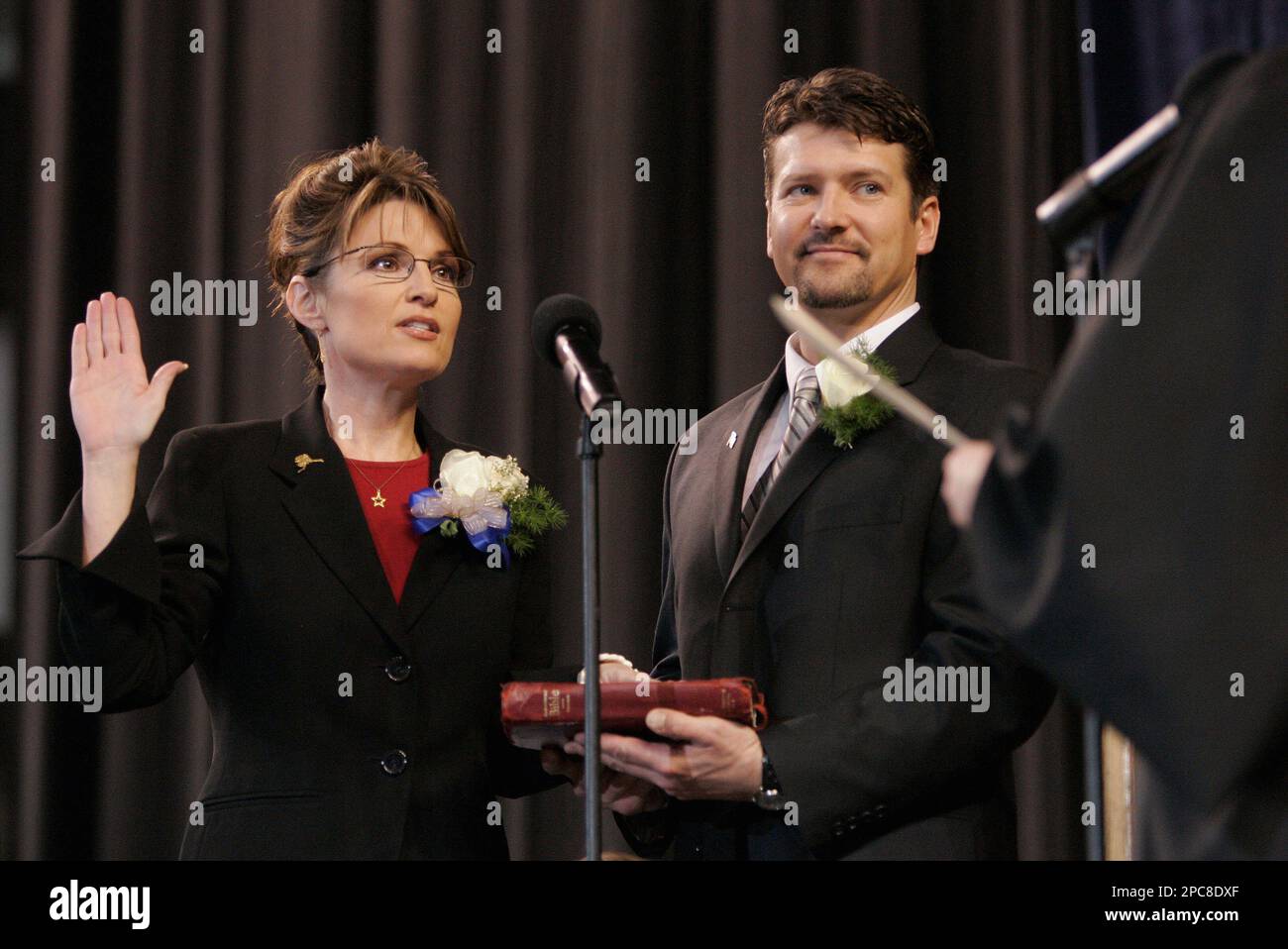 Sarah Palin, left, is sworn in as Alaska governor by Superior Court ...