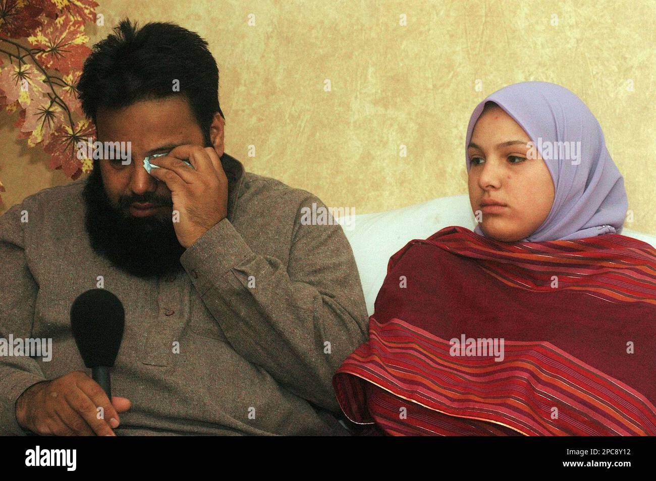 Sajad Ahmed Rana, left, father of Scottish girl Molly Campbell, also ...