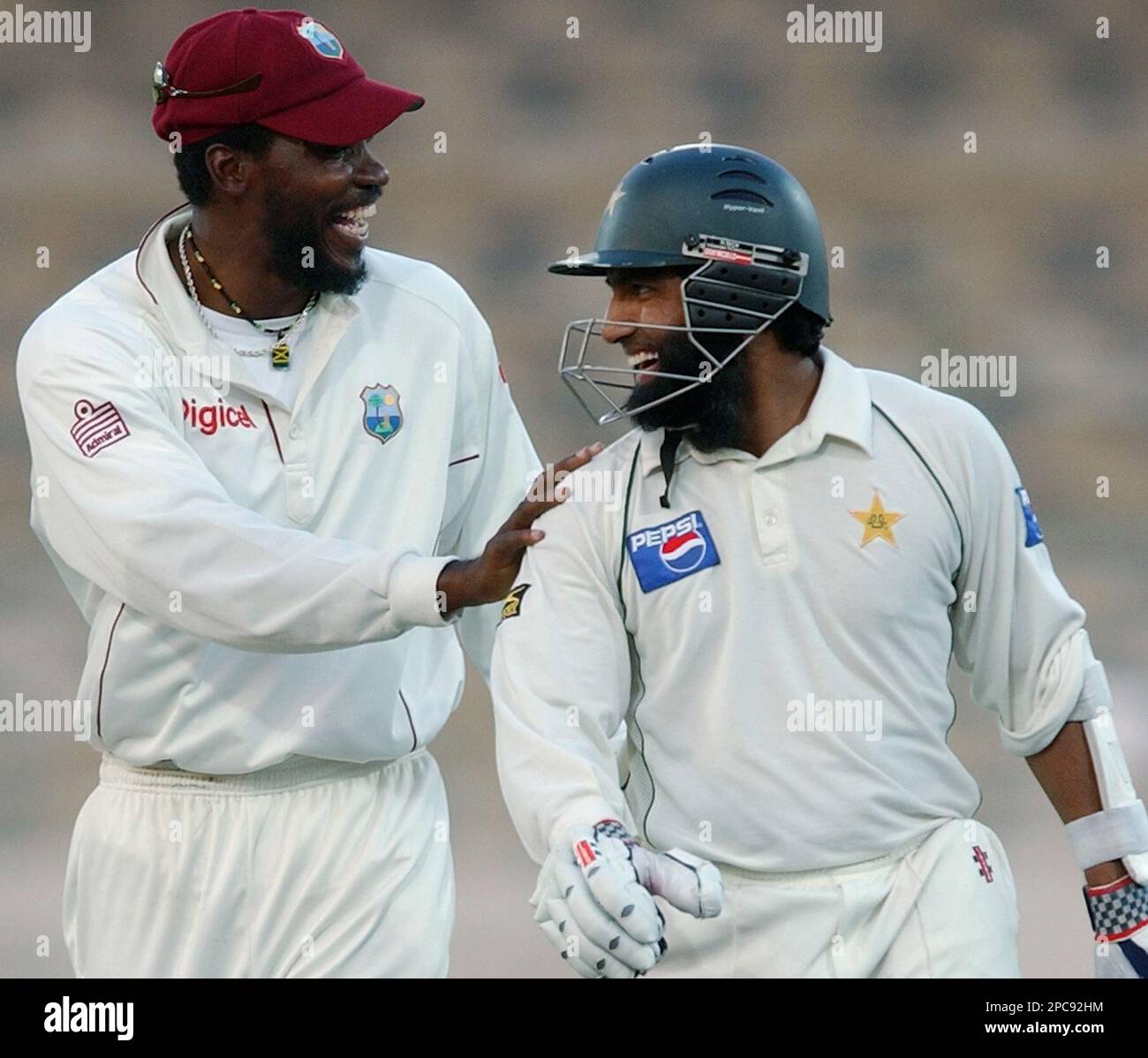 West Indies' player Chris Gayle, left, greets Pakistani batsman ...