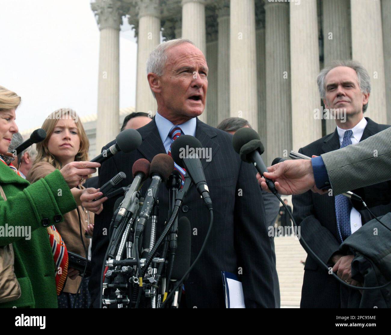 Massachusetts Attorney General Thomas Reilly, center, speaks to ...