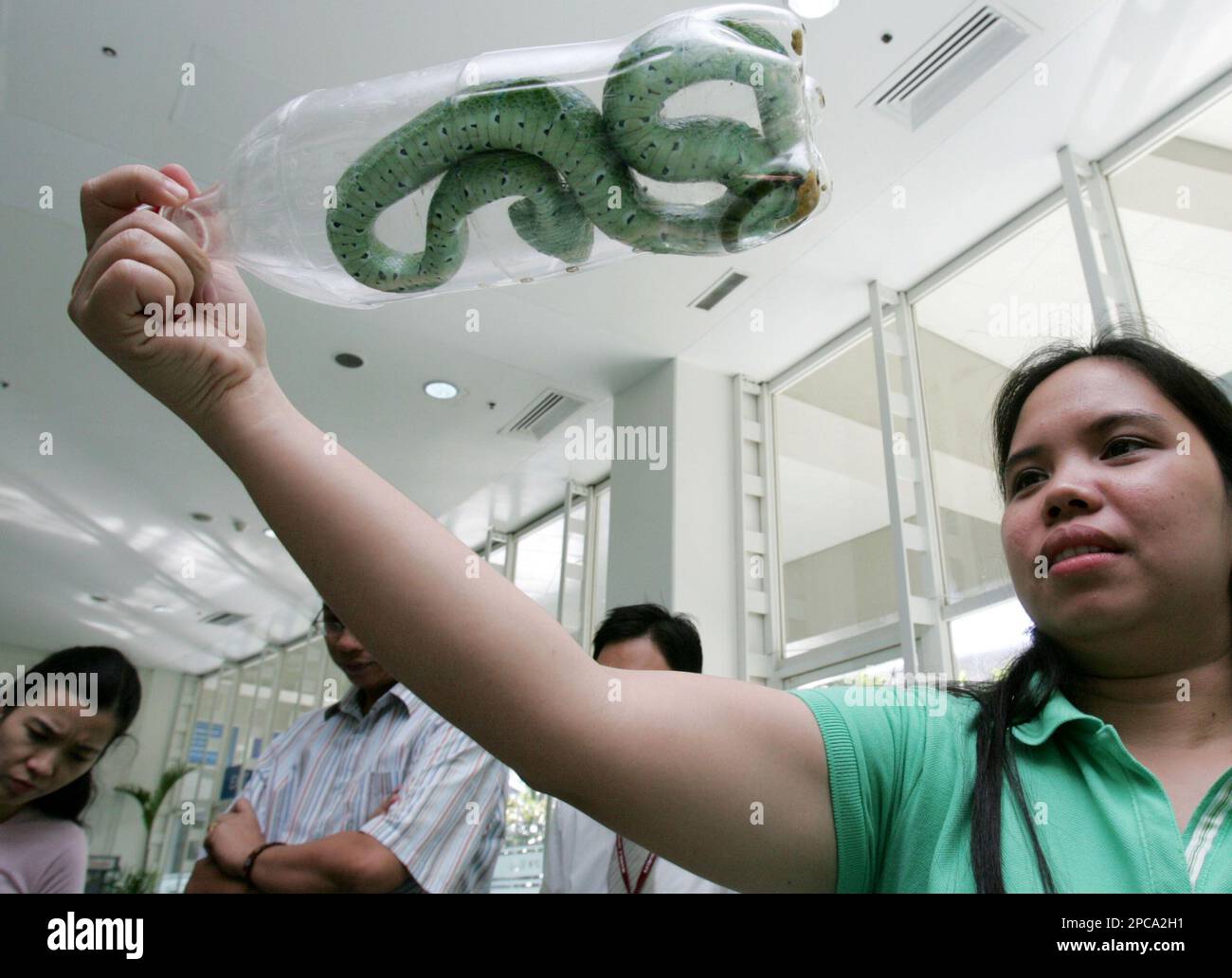 Gisele Garcia of the Regional Wildlife Management Council examines a ...