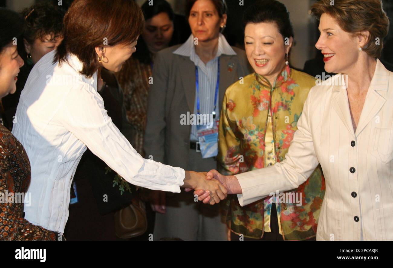 Japanese First Lady Akie Abe, left, shakes hands with United States ...