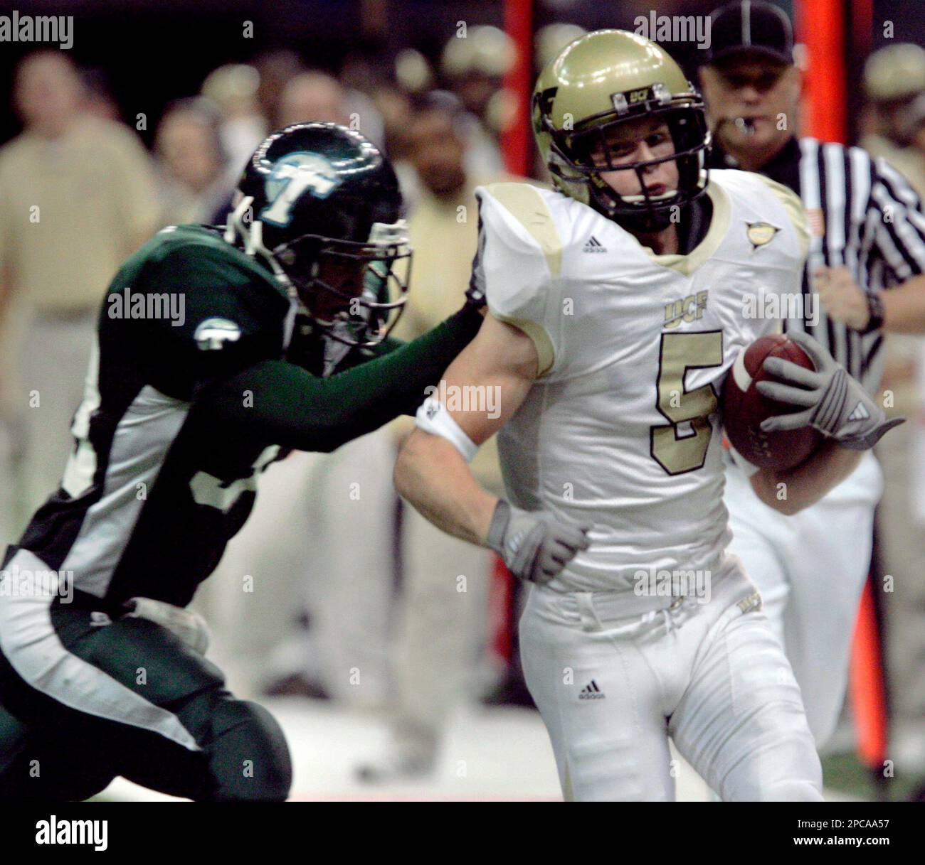 Central Florida wide receiver Rocky Ross (5) gets knocked out of bounds ...