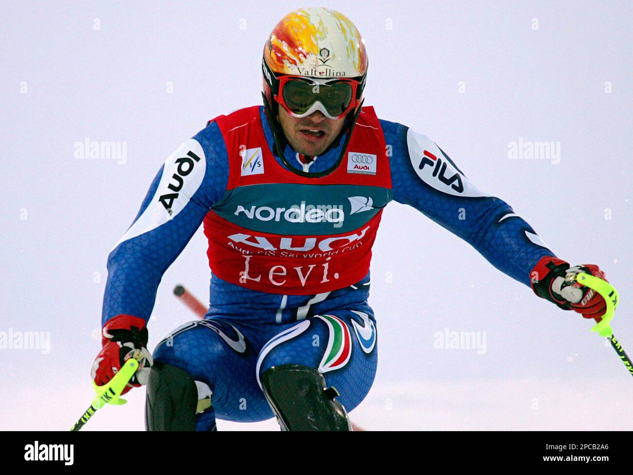 Italy's Giorgio Rocca slaloms past a pole on his way to clock the ...