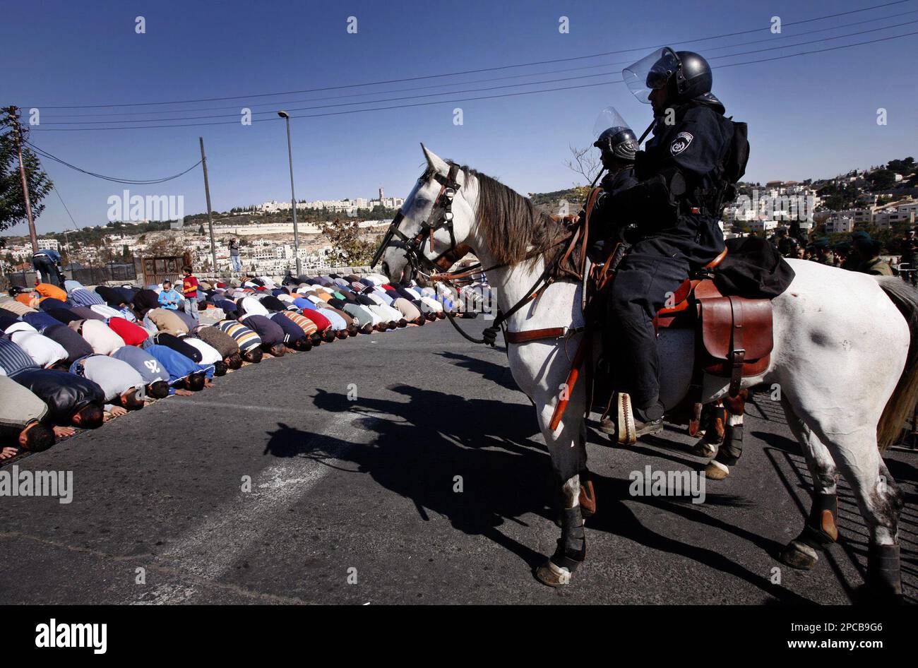 Israeli border police on horse back stand guard as Muslim worshippers ...