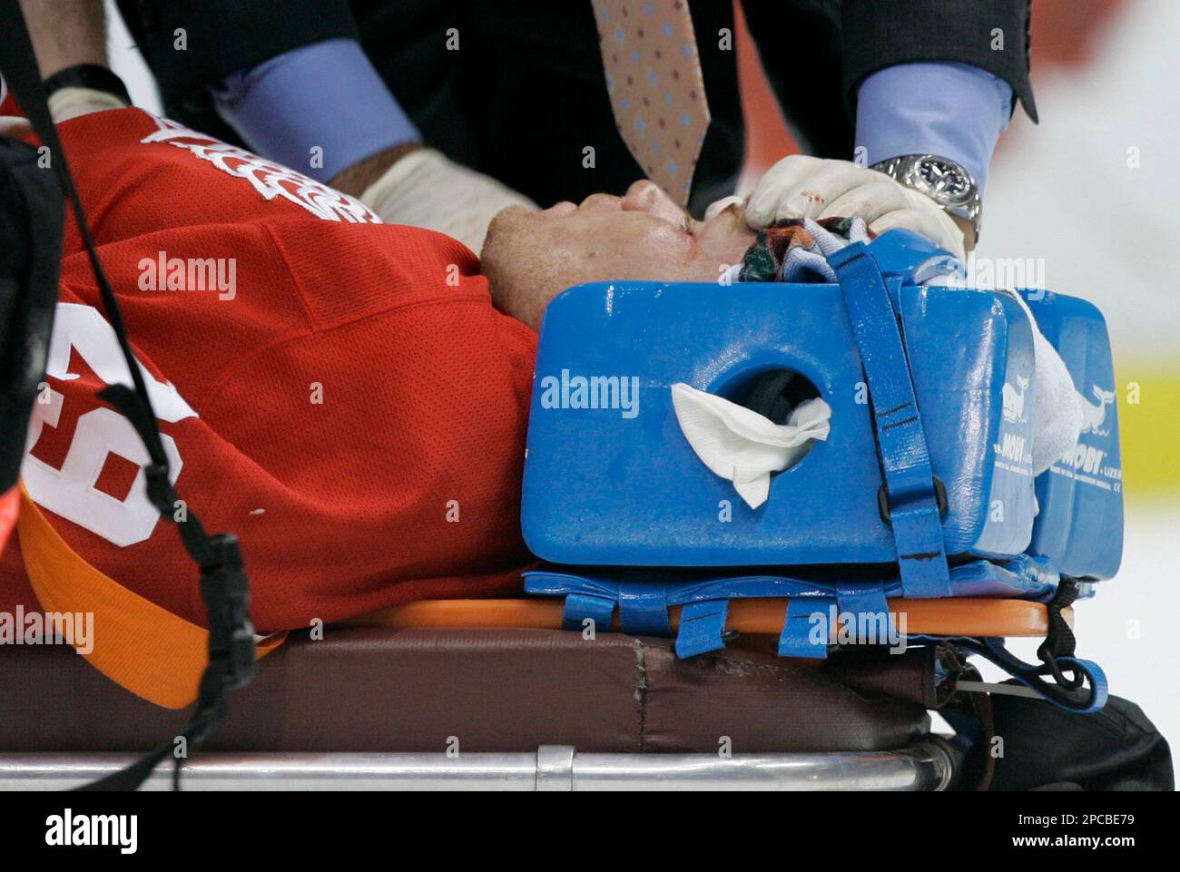 Detroit Red Wings' Jason Williams is attended to by team medical ...