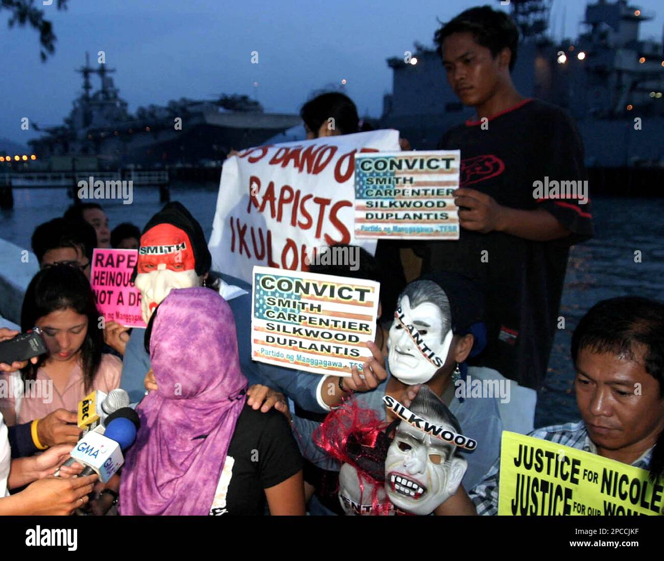 Alleged Filipino rape victim with an alias of Nicole, second from left ...