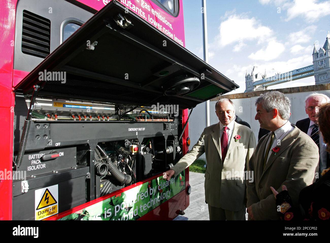 Mayor of London, Ken Livingstone, left, examines the engine as he ...