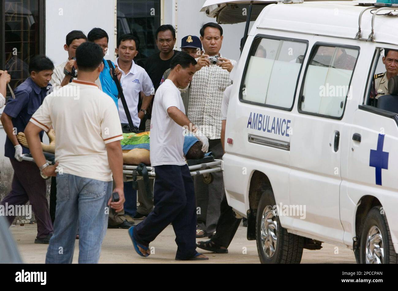 Donald Rene Ramirez's body is carried into an ambulance heading for a ...