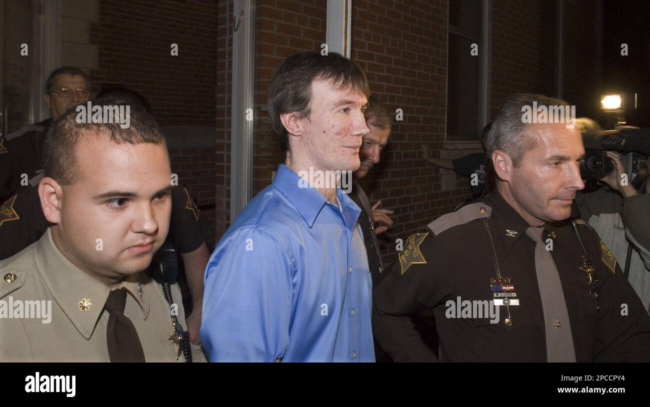 John R. Myers II, center, is escorted by Morgan County Sheriff's ...