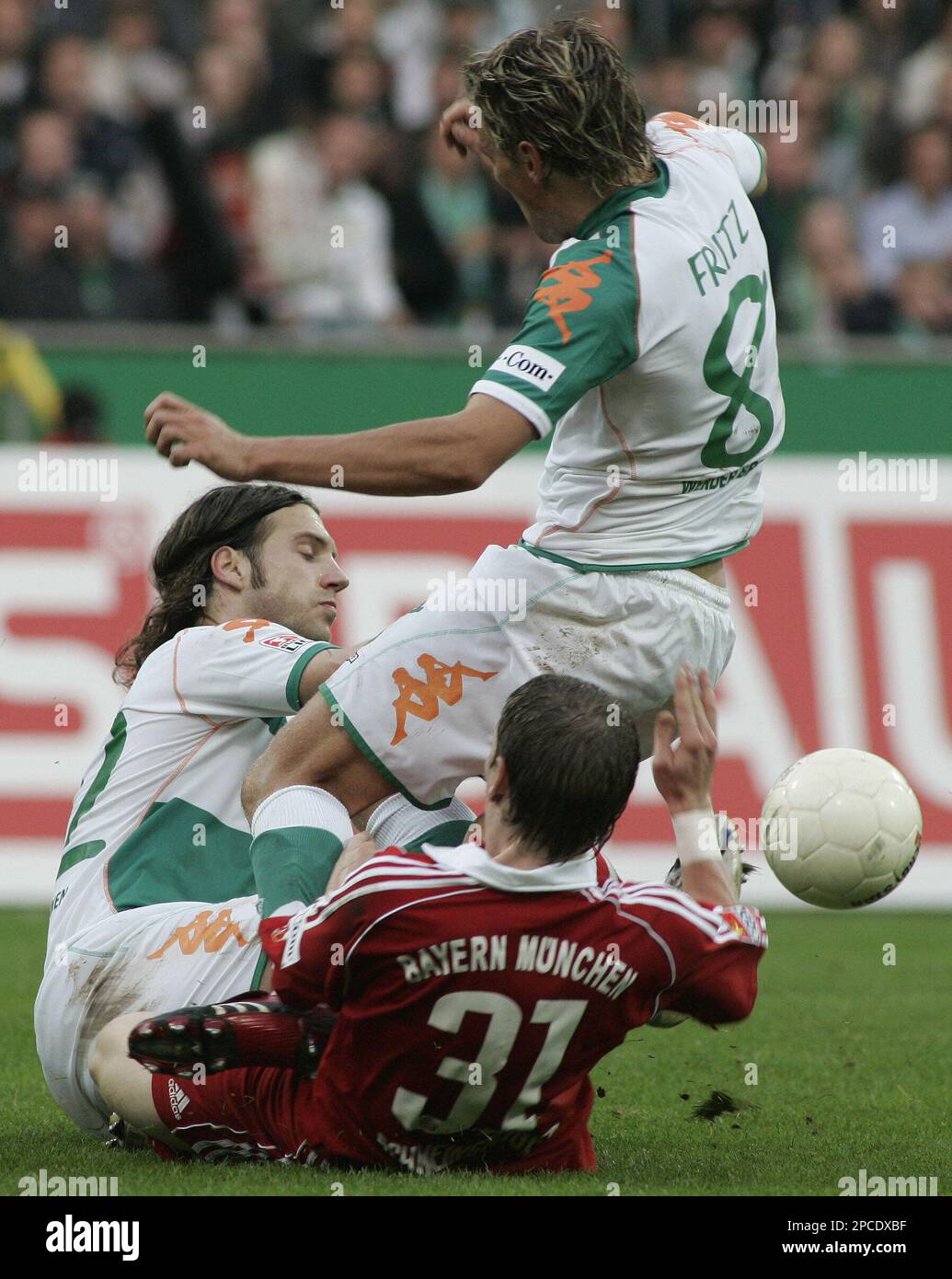 Torsten Frings, left, and Clemens Fritz, top right, of Werder Bremen ...