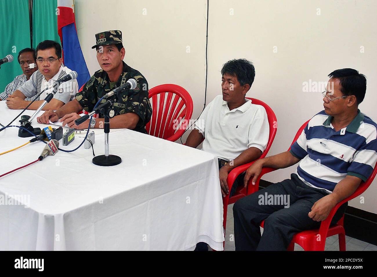 Western Mindanao Command chief Lt. Gen. Eugenio Cedo, center, presents ...