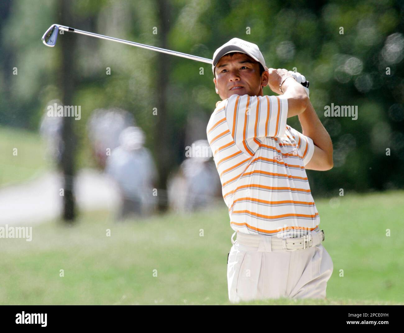 Shigeki Maruyama of Japan, hits a shot from the 18th fairway during the ...