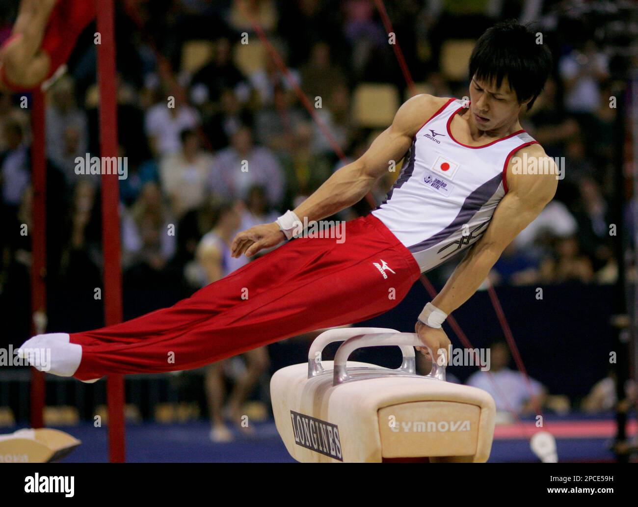 Silver medalist Tomita Hiroyuki of Japan competes on the pommel horse ...