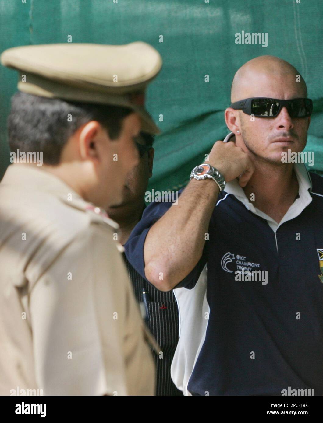 South African cricketer Herschelle Gibbs, right, arrives at the police ...