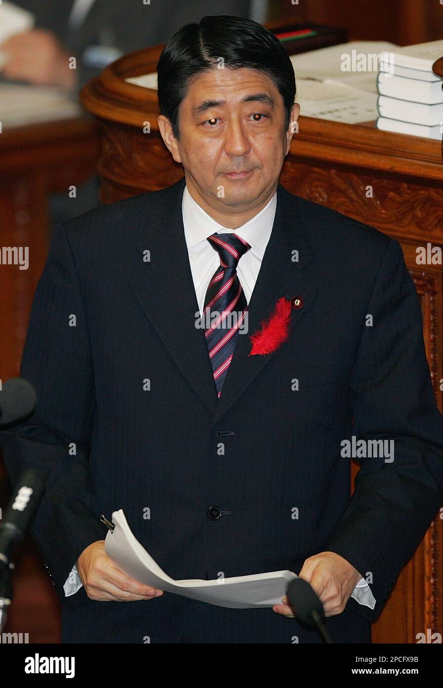Japanese Prime Minister Shinzo Abe walks to the podium to answer to ...