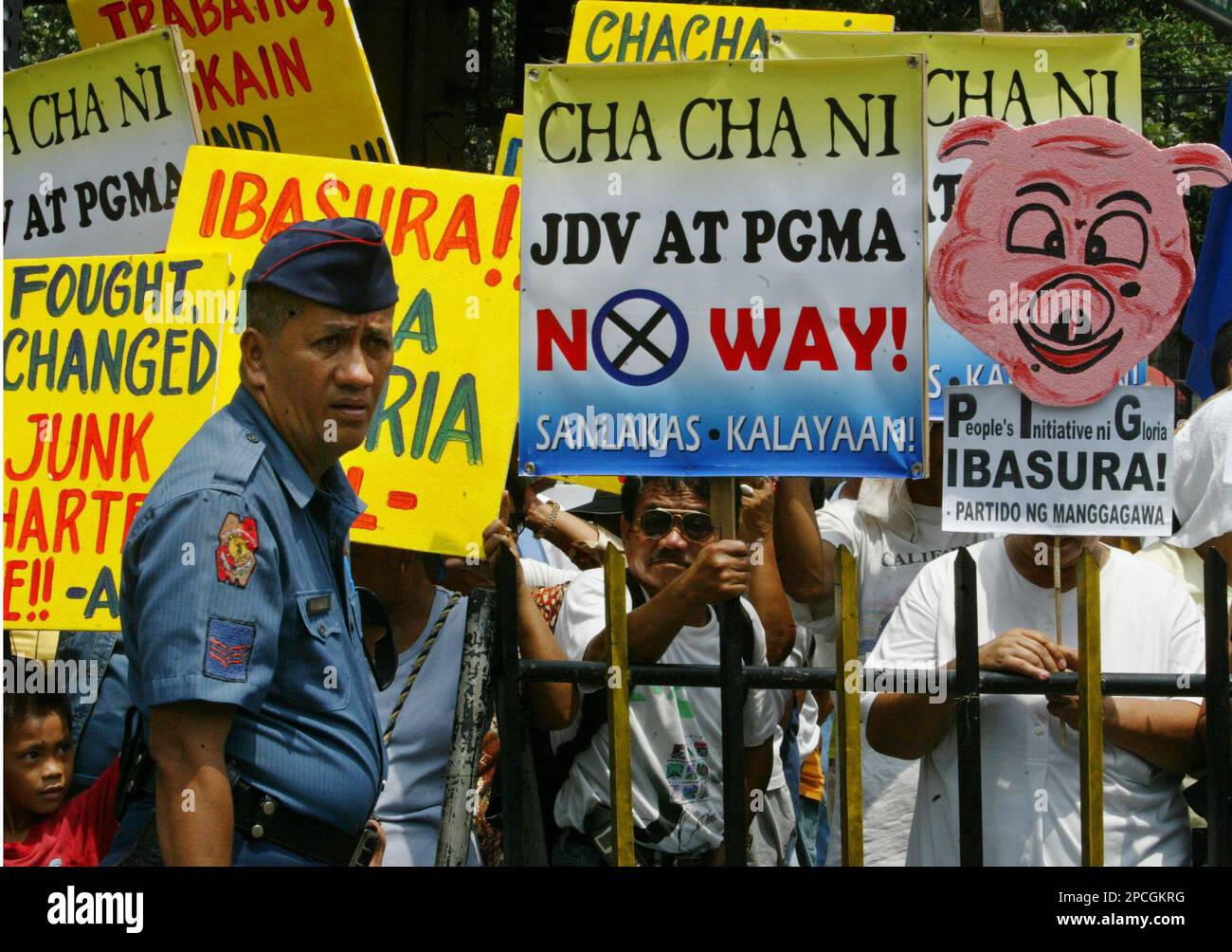 Protesters display placards during a rally outside the Philippine ...