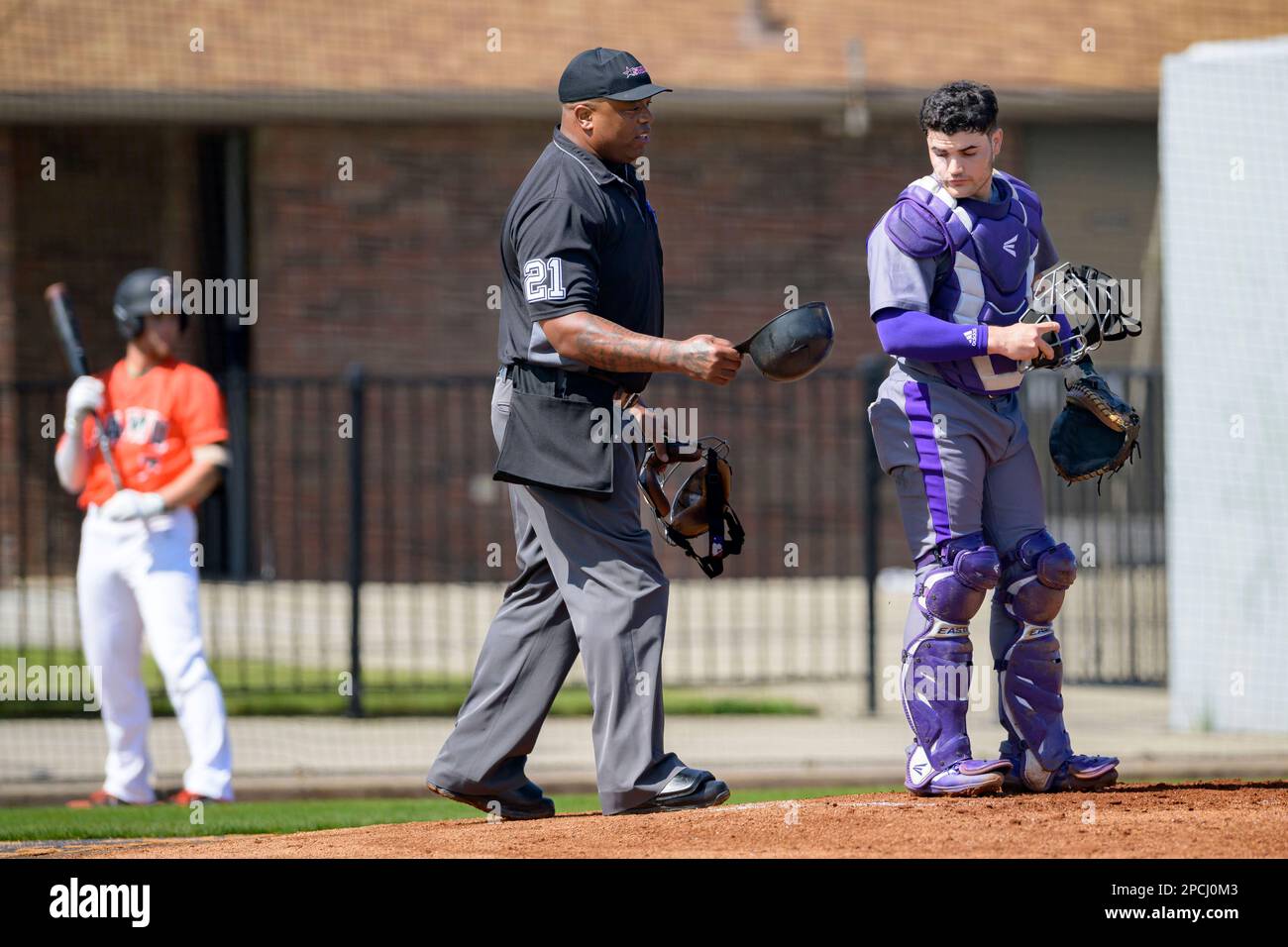 Home plate umpire Reggie Drummer is seen during an NCAA baseball game ...