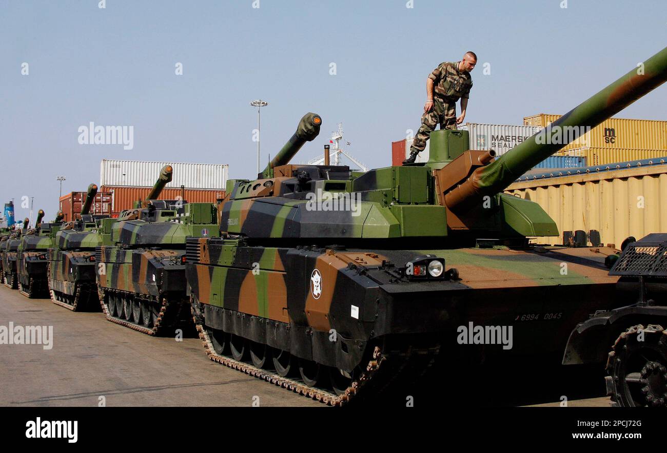 A French U.N. peacekeeper standa atop a Leclerc tank parked in line ...