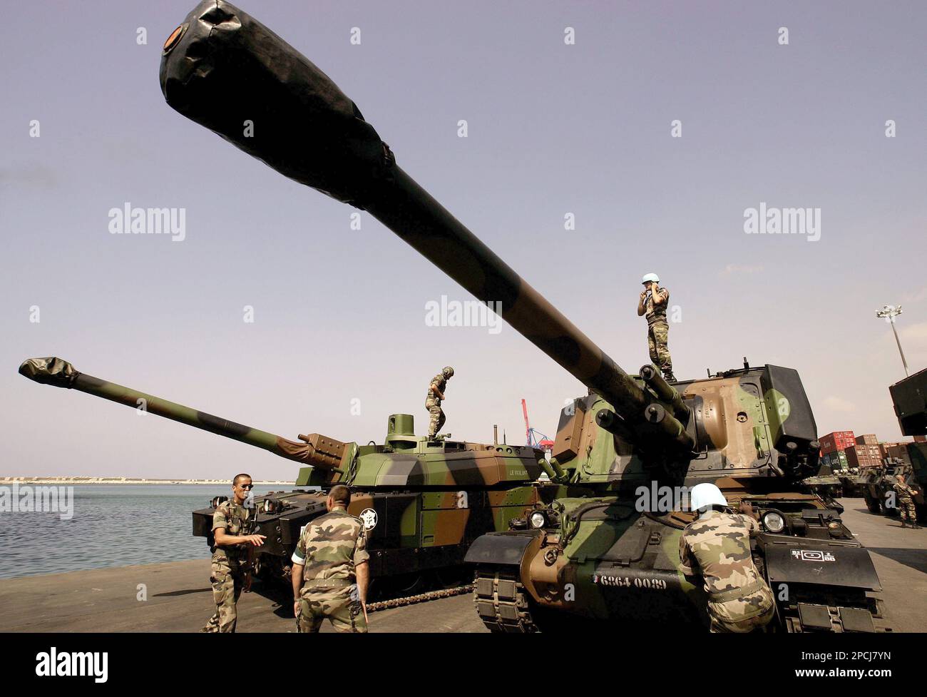 French U.N. peacekeepers get atop a Leclerc tank, left and a AUF1 ...