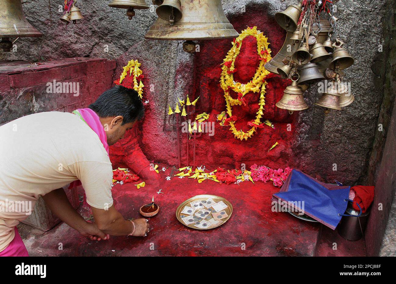 A devotee prays at Kamakhya temple in Gauhati, India, Tuesday, Sept. 12 ...
