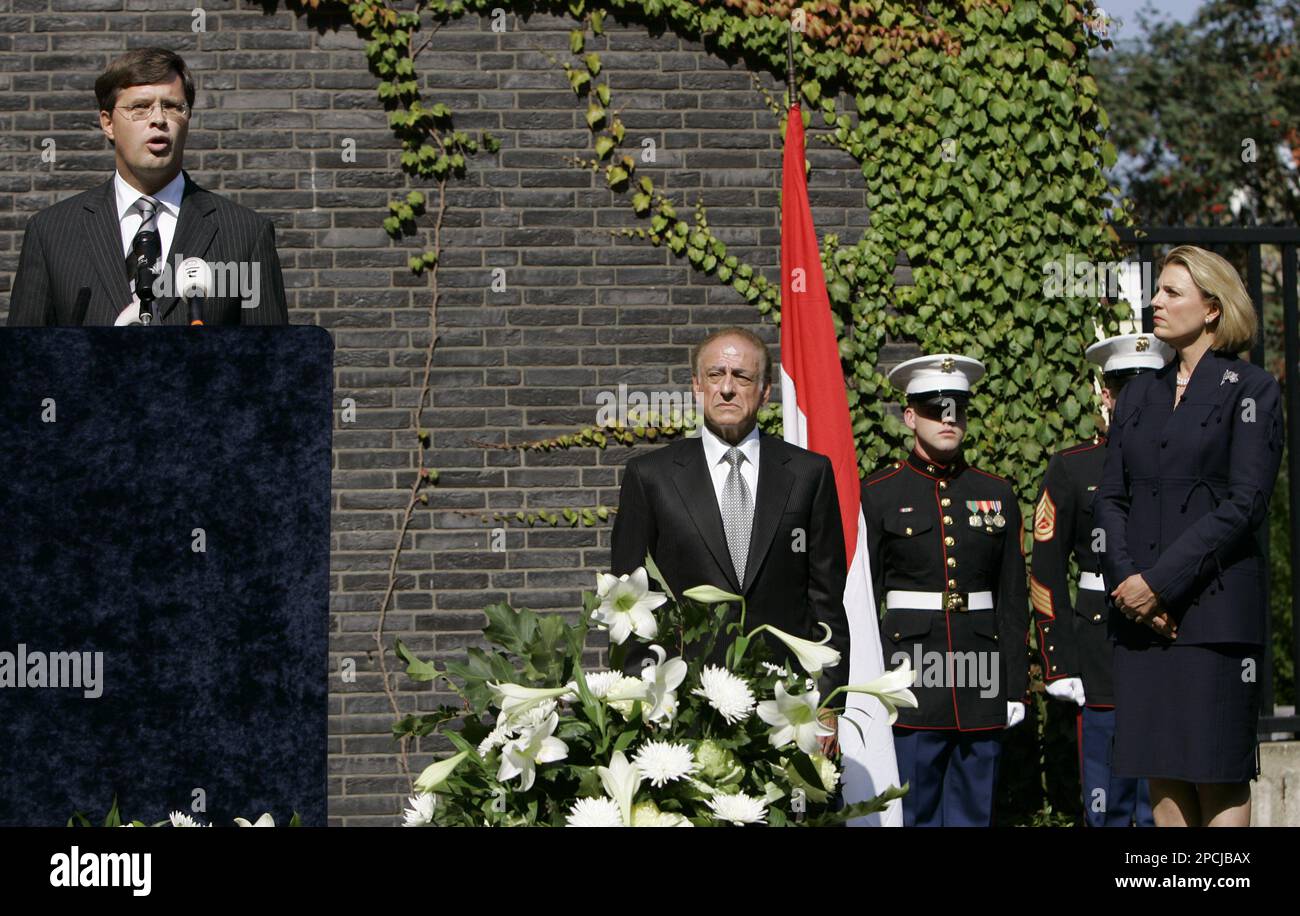 U.S. ambassador to the Netherlands Roland E. Arnall, center and his ...