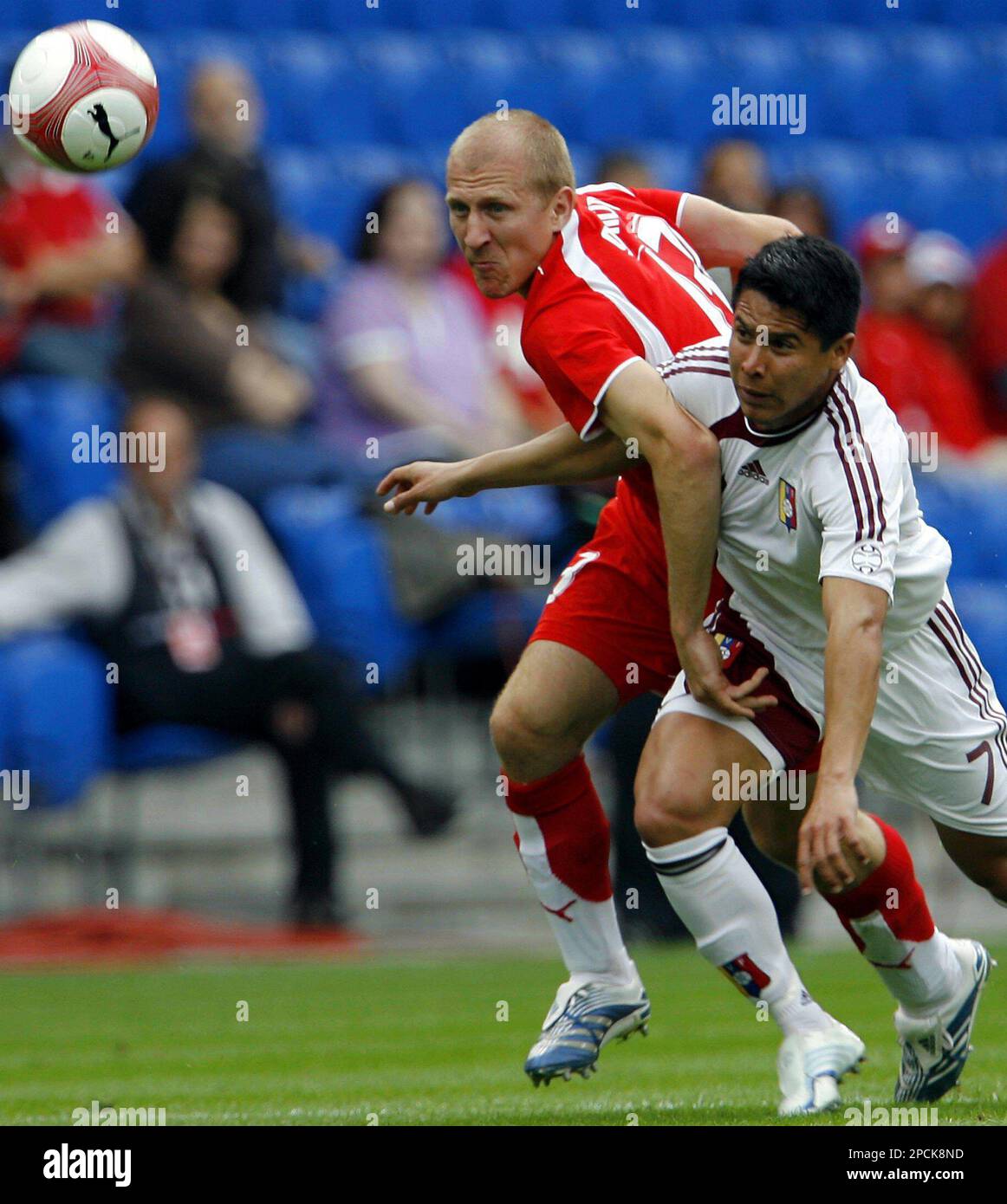 Switzerland's Stephane Grichting, left, fights for the ball against ...