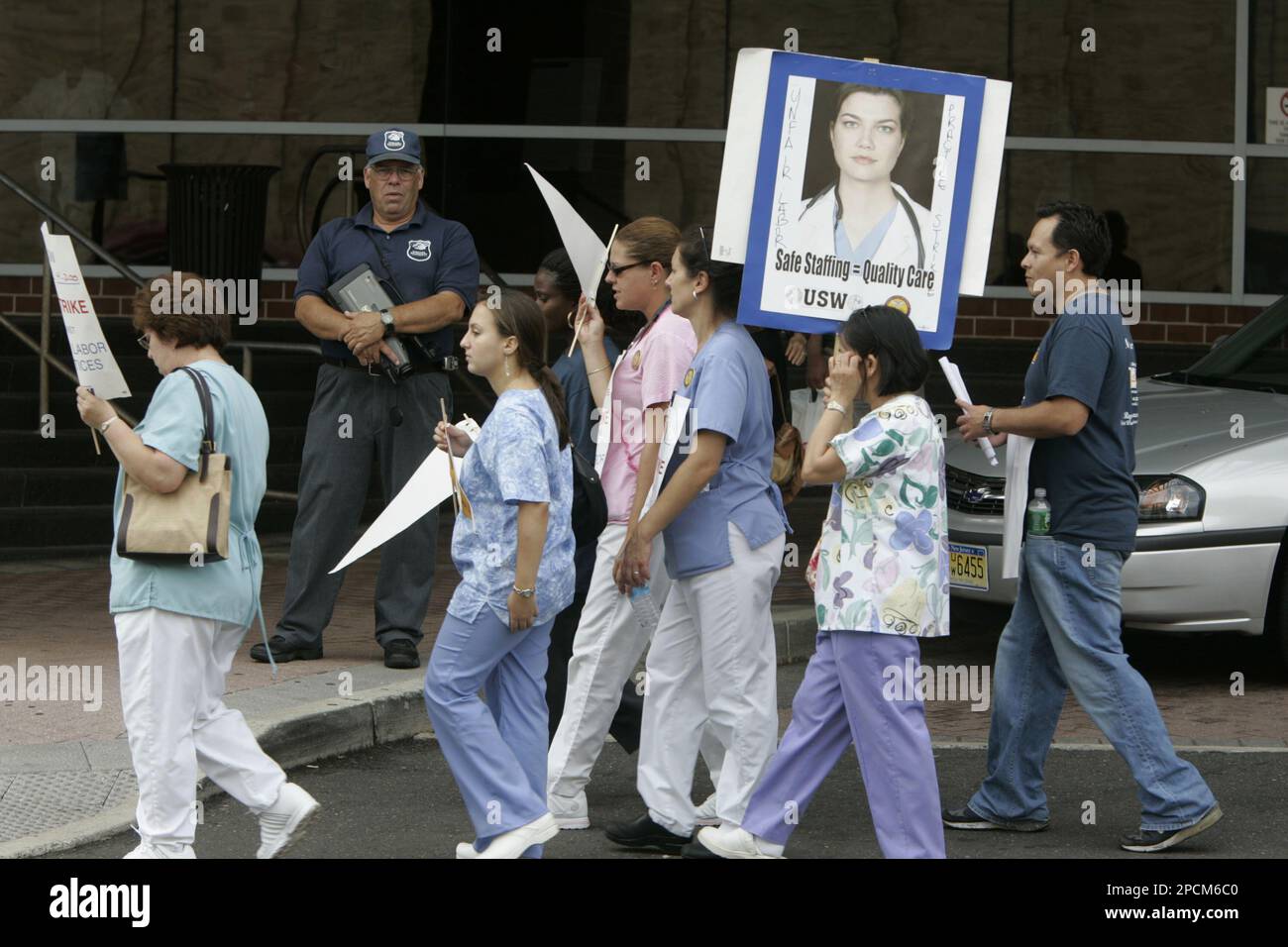 Striking nurses walk a picket line outside Robert Wood Johnson ...