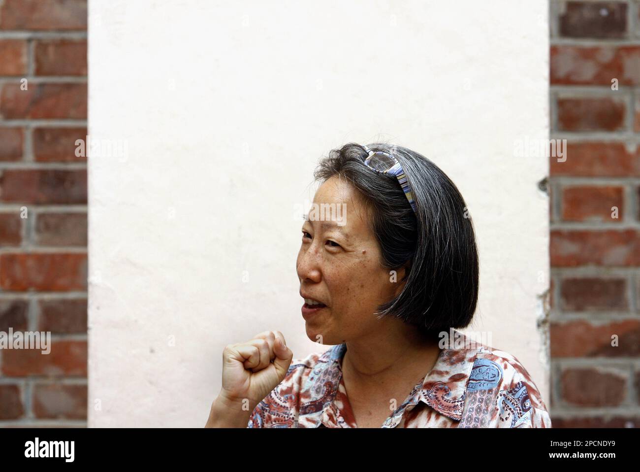 Chinese-American writer Gish Jen speaks to a reporter on the University ...