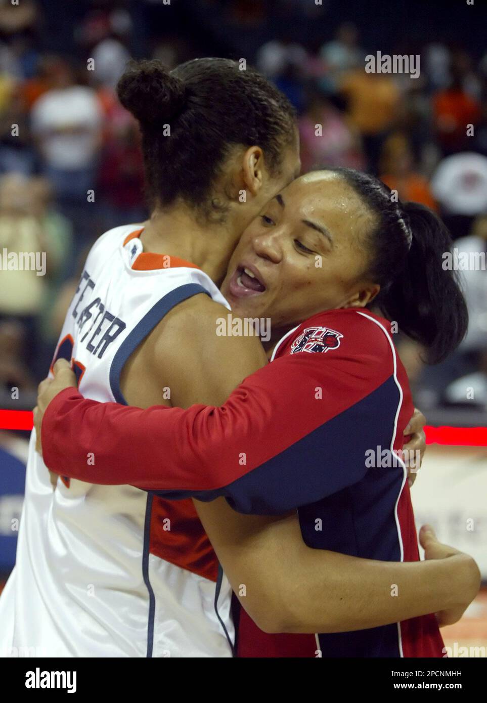 Houston Comets guard Dawn Staley, right, hugs former teammate ...