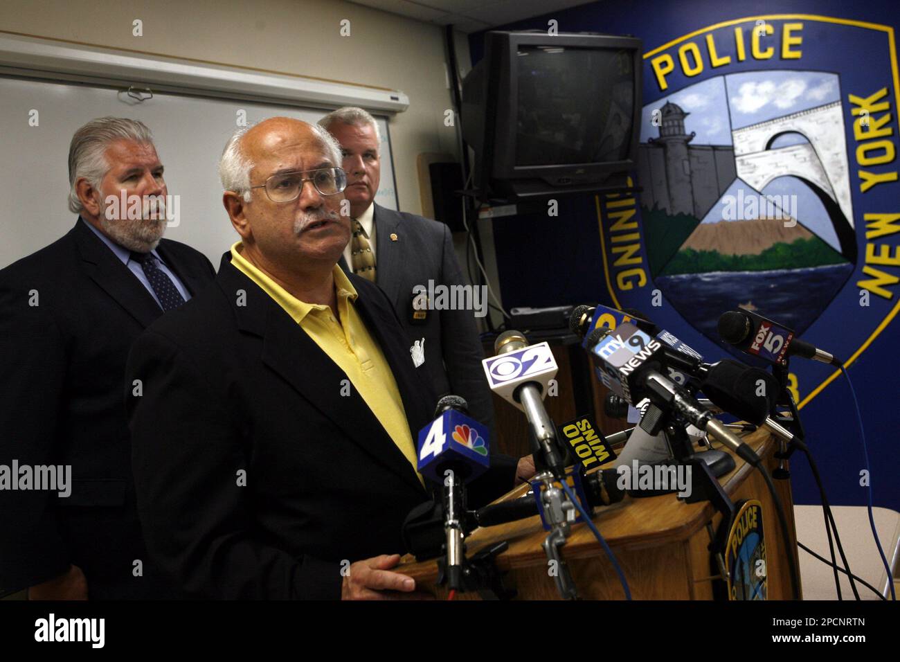 Ossining Mayor Miguel Hernandez, center, flanked by Ossining Police ...