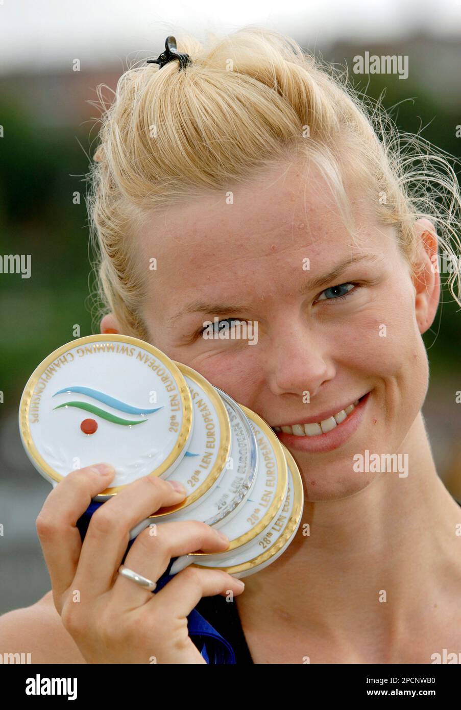 Germany's Britta Steffen shows the four gold medals and silver medal ...