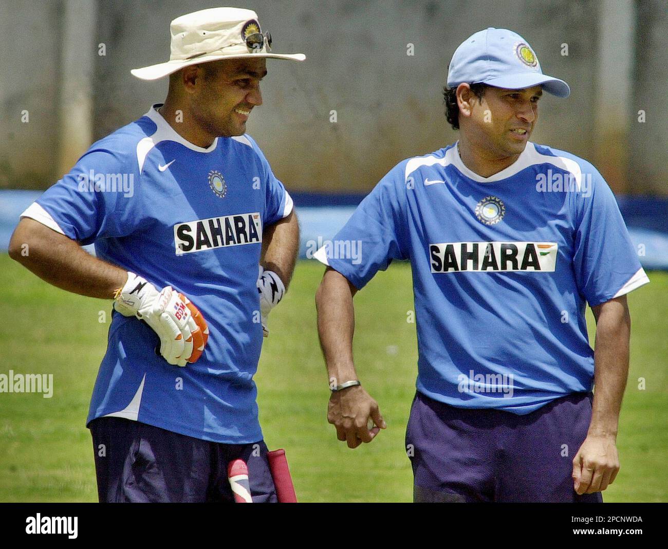 Indian cricketers Virender Sehwag, left, and Sachin Tendulkar watch ...
