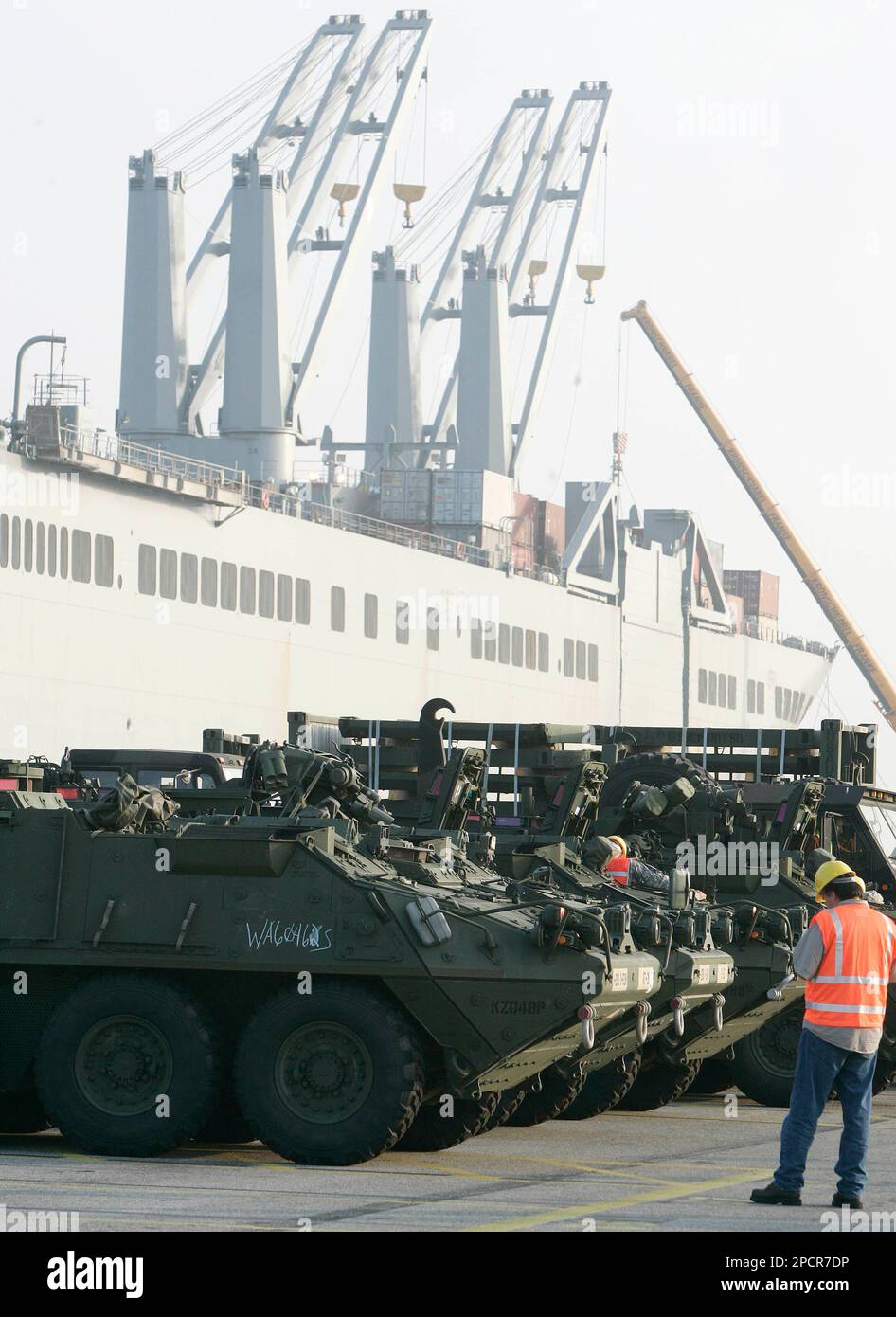 The first 120 of a total of 309 "Strykers" roll off the U.S. Navy cargo ...