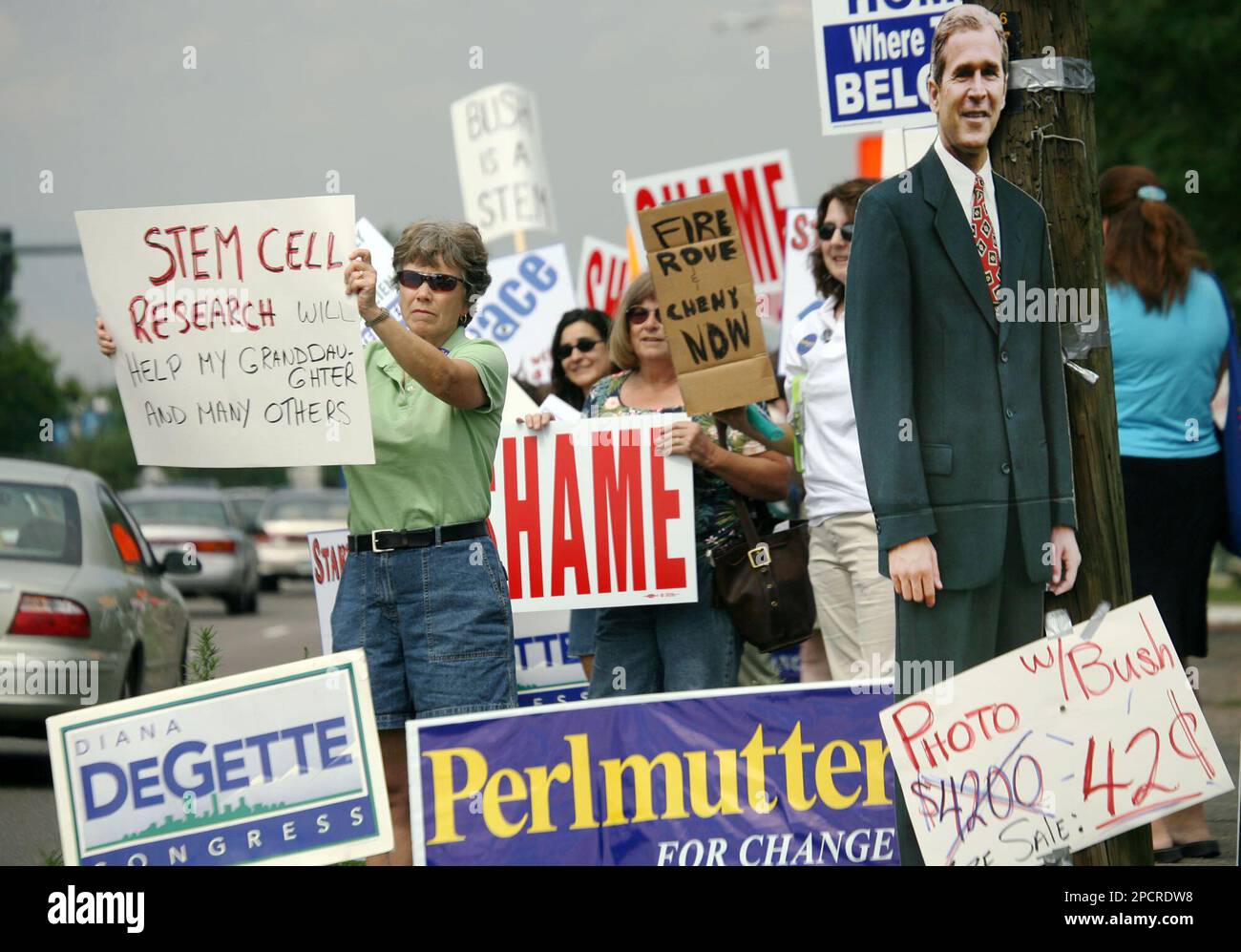 With a cutout of President Bush at right, Sally Kaesemeyer, left, of ...