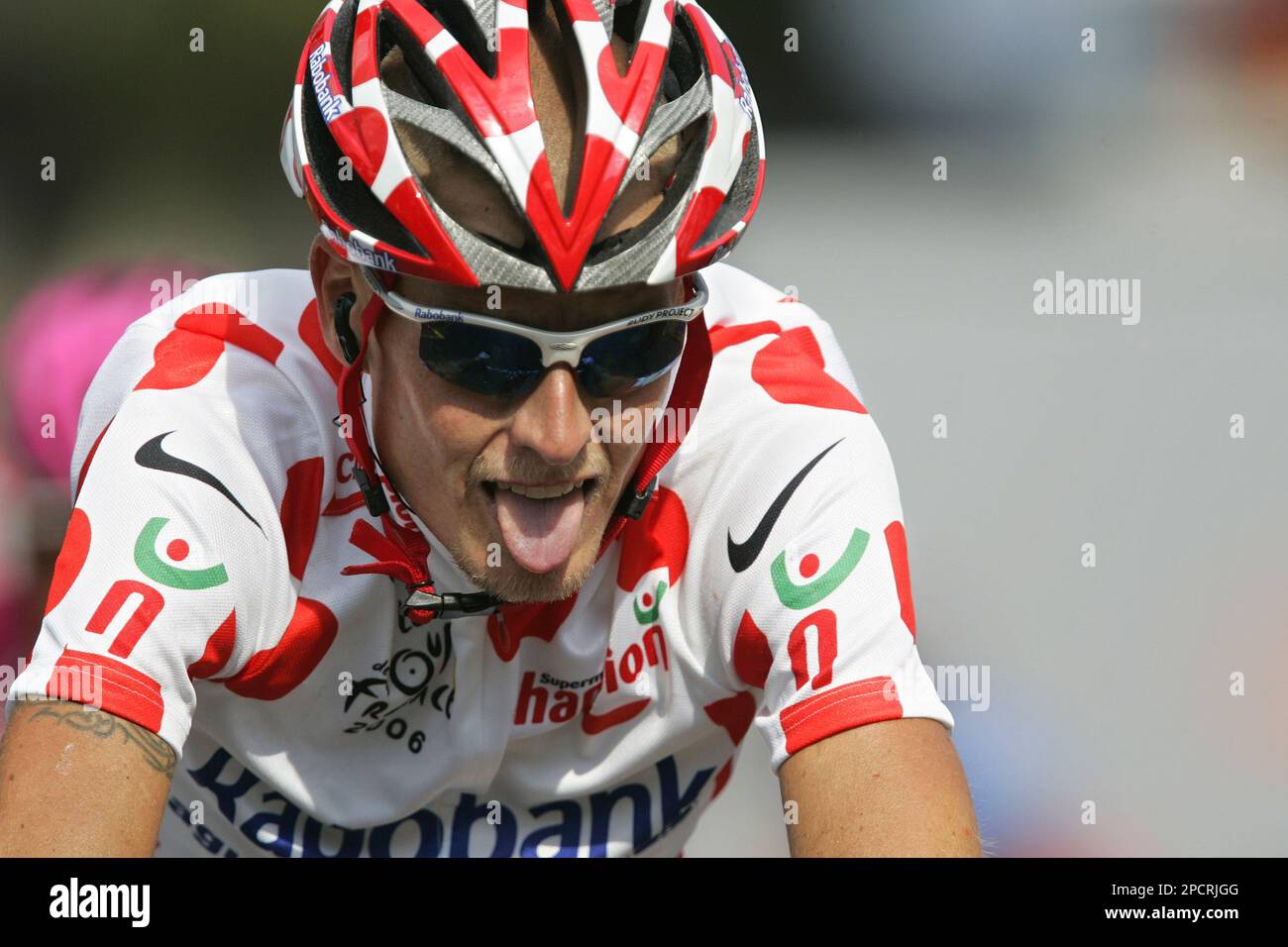 Best climber Michael Rasmussen of Denmark reacts as he crosses the ...