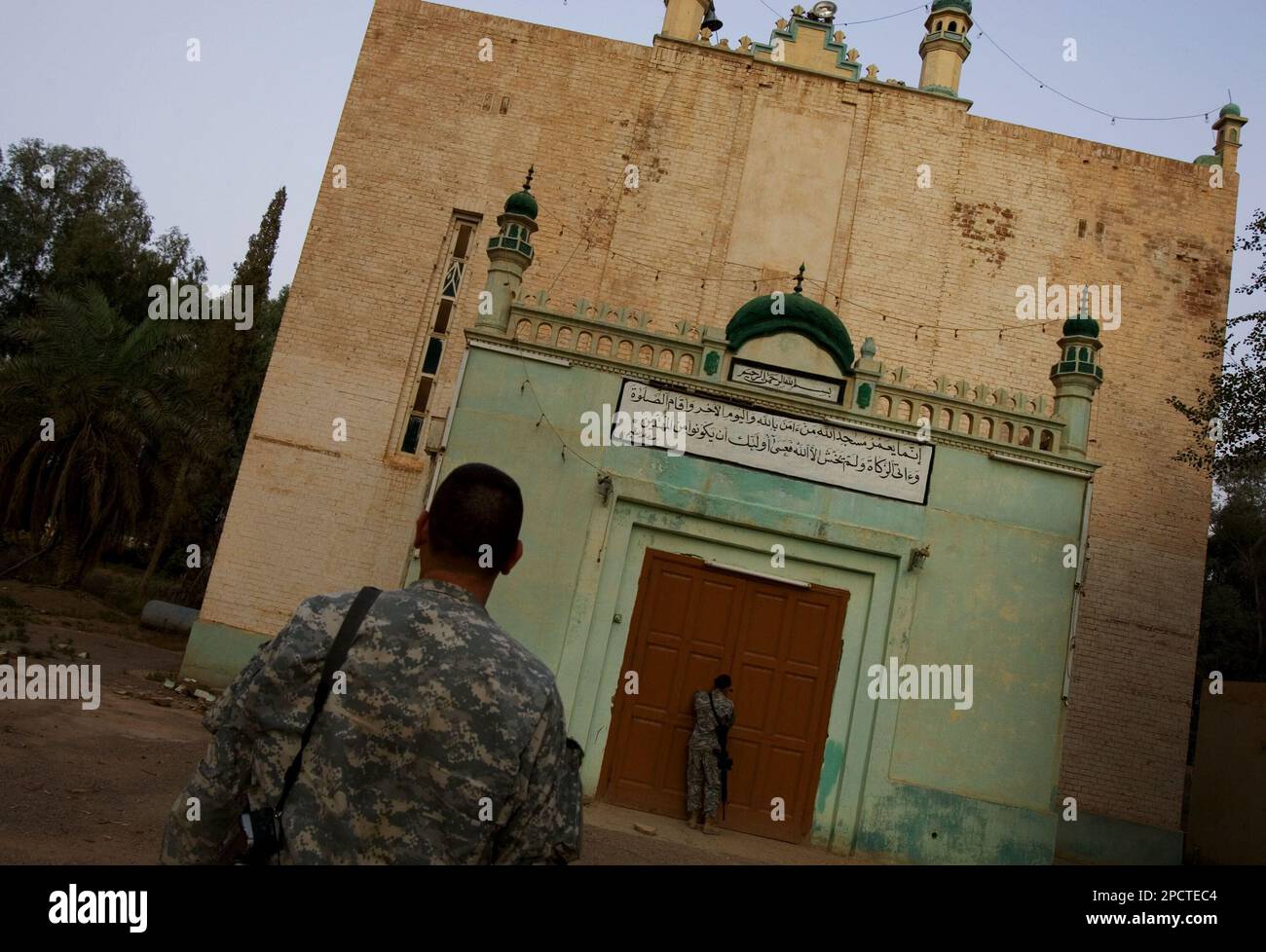 U.S. Army soldiers look at the remains of a church first built by the ...
