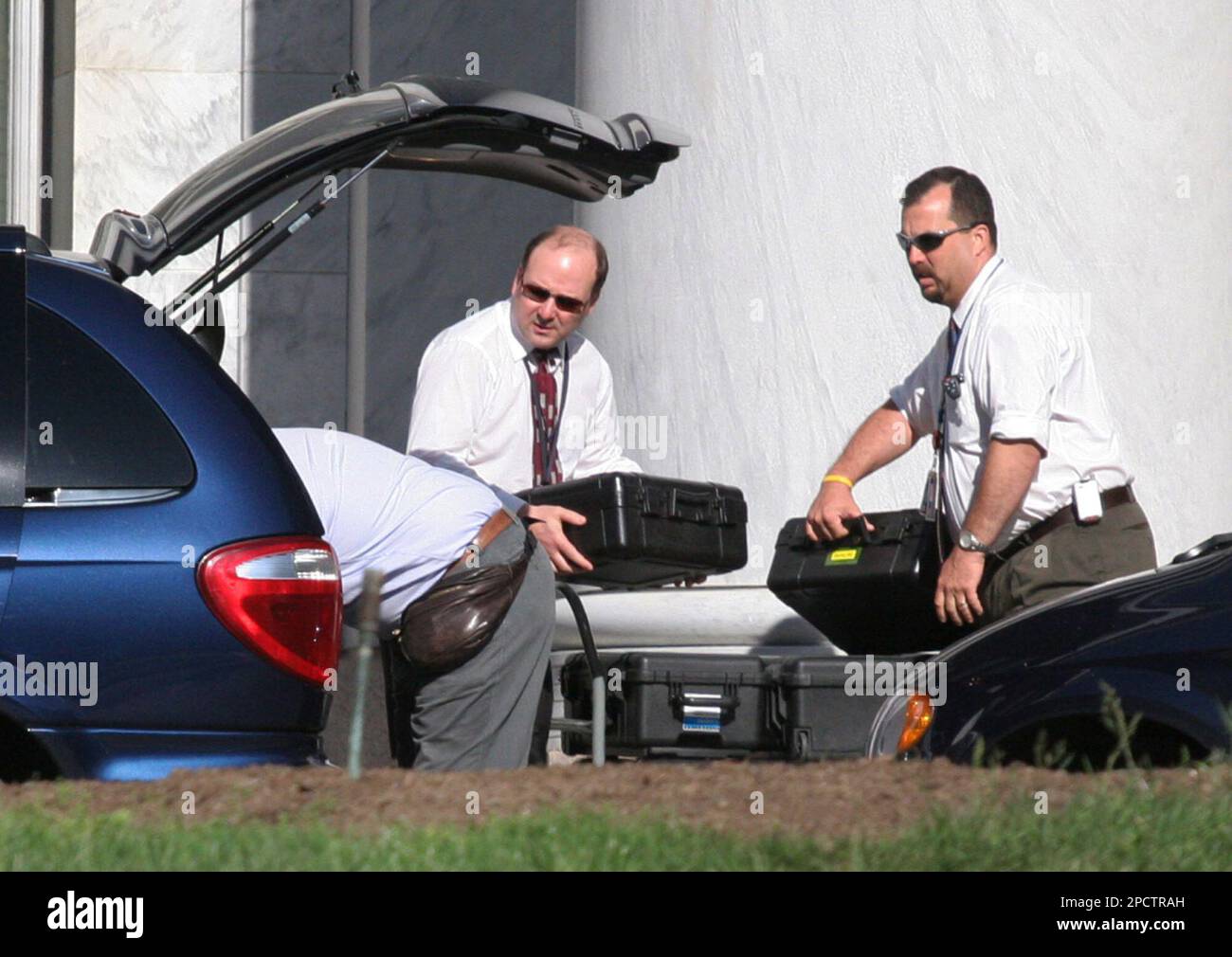 ** FILE ** FBI agents load the back of a minivan at the Rayburn House ...