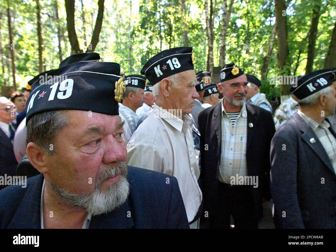 Crew members of the K-19 nuclear submarine, stand during a remembrance ...