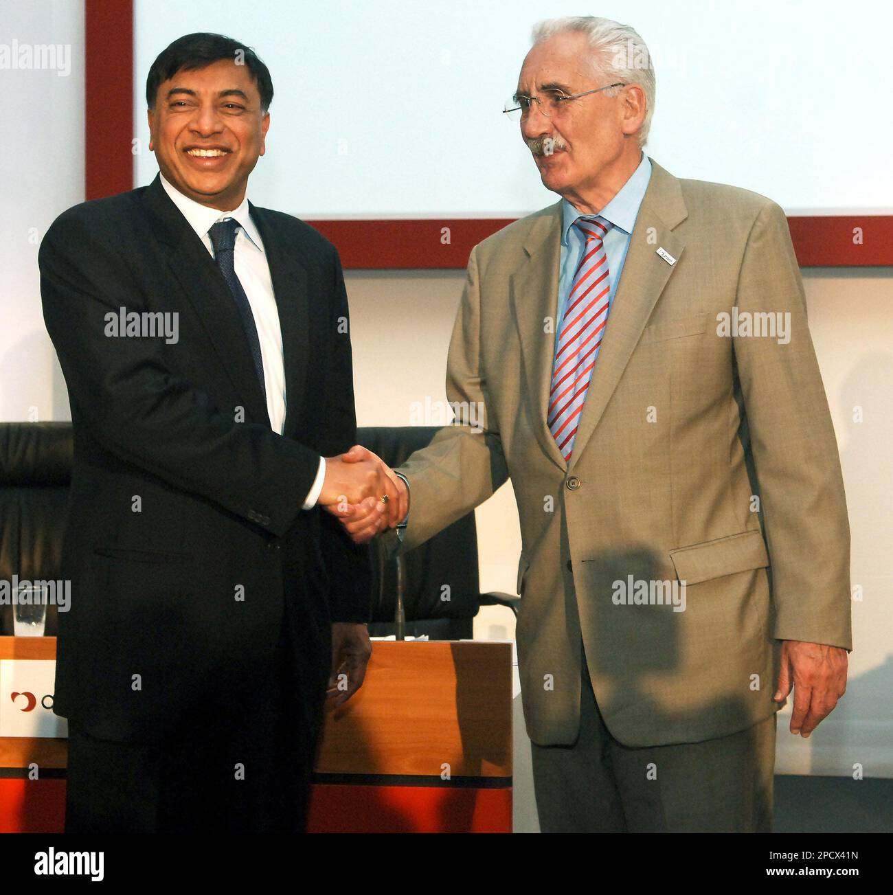 Head of Mittal Steel Lakshmi Mittal, left, shakes hands with the ...