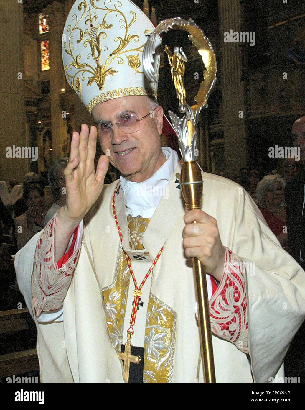 Italian Cardinal Tarcisio Bertone gestures on his way to celebrate mass ...