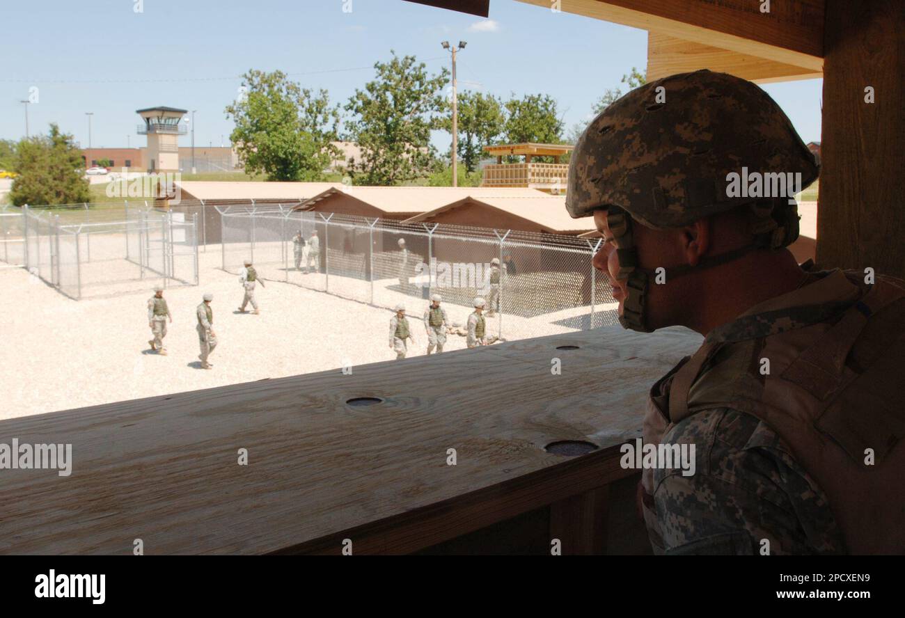 Pvt. Robert Privett, left, watches U.S. Army soldiers posing as ...