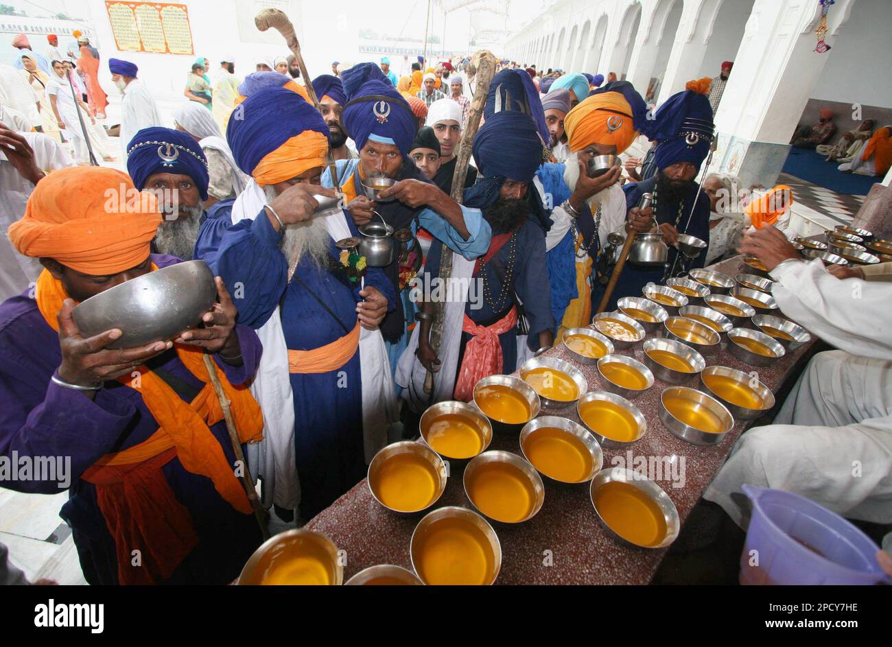 Nihangs, or Sikh warriors, drink flavored water at Darbar Sahib ...