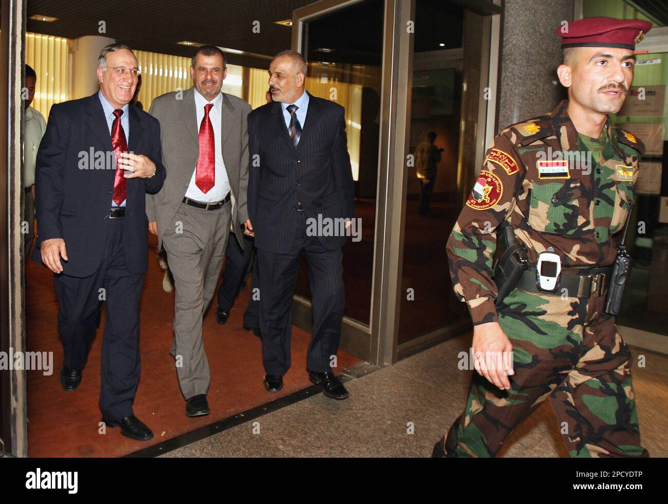 (Left to right) Iraqi Defence Minister Abdul-Qader Mohammed Jassim ...