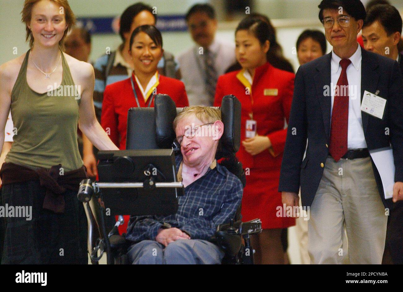 Professor Stephen Hawking, center, of the University of Cambridge is ...