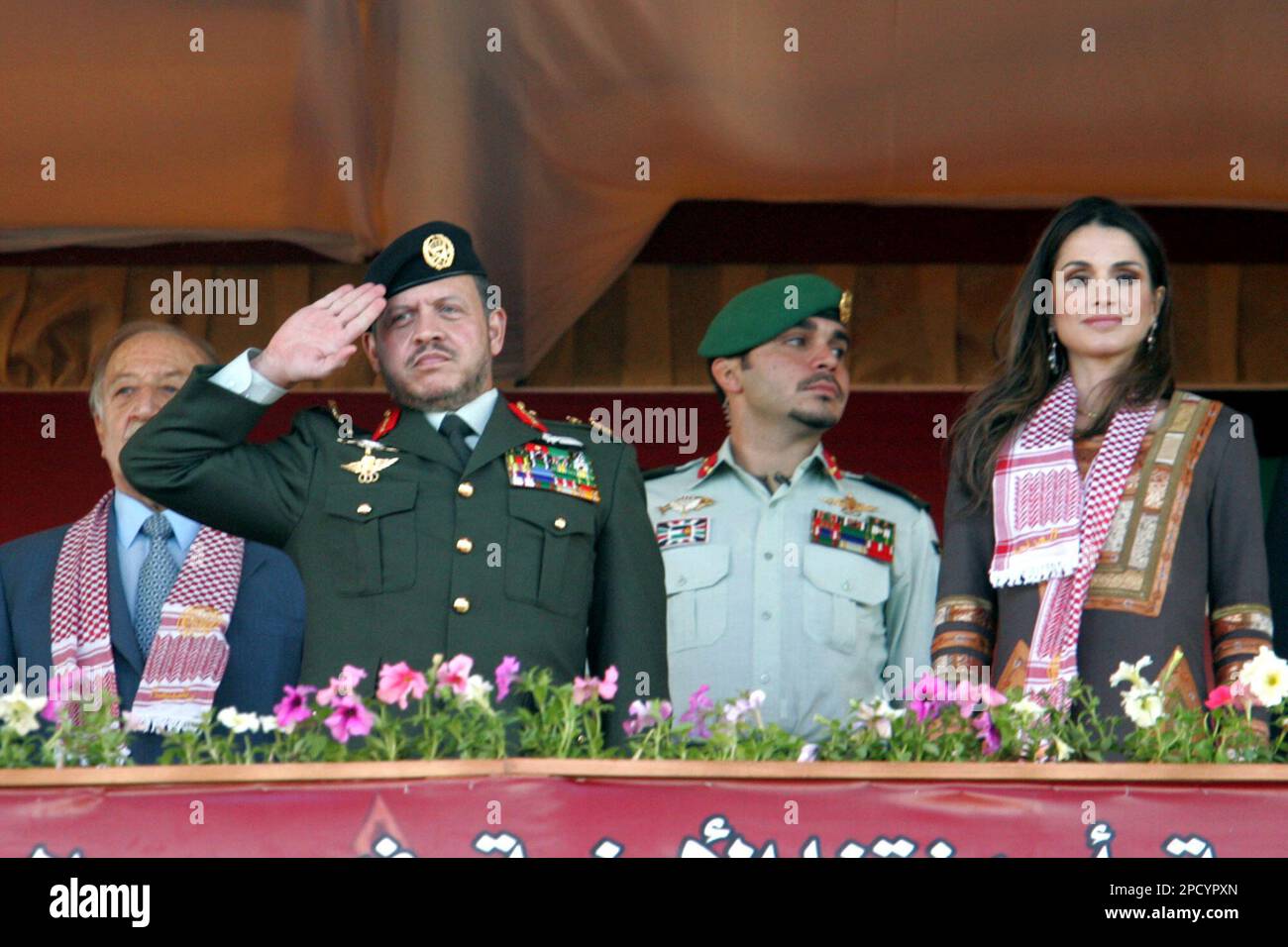 King Abdullah II of Jordan, left, and his wife Queen Rania, right ...